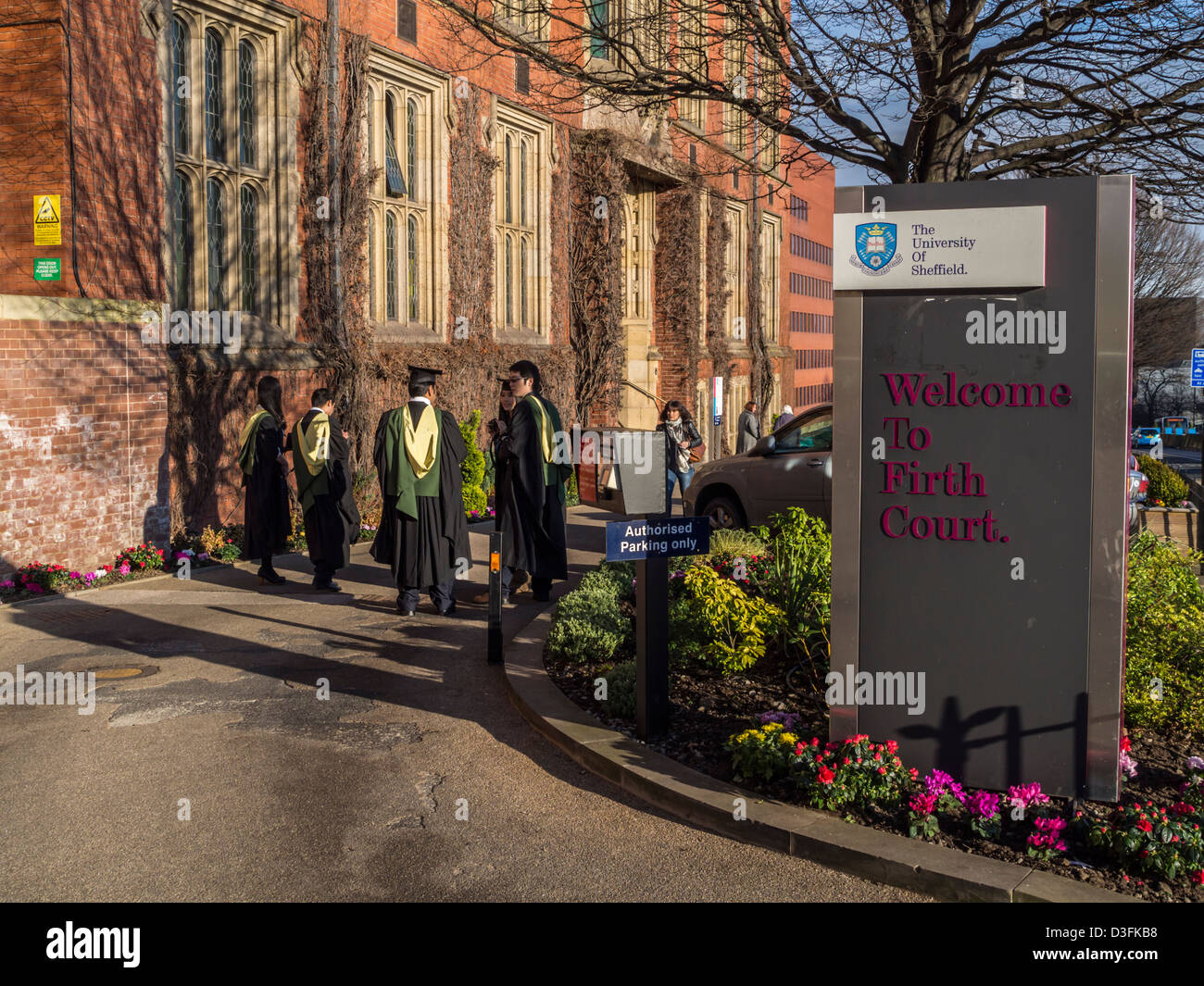 Graduates in robes standing in front of Firth Court University of ...