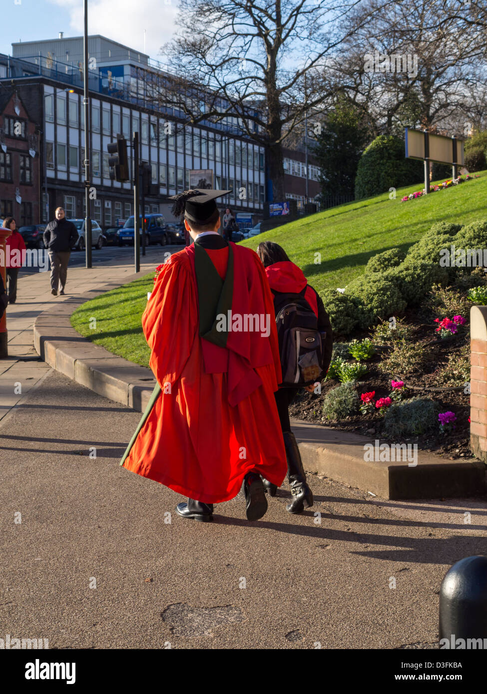 New graduates on graduation day wearing caps and gowns around the ...
