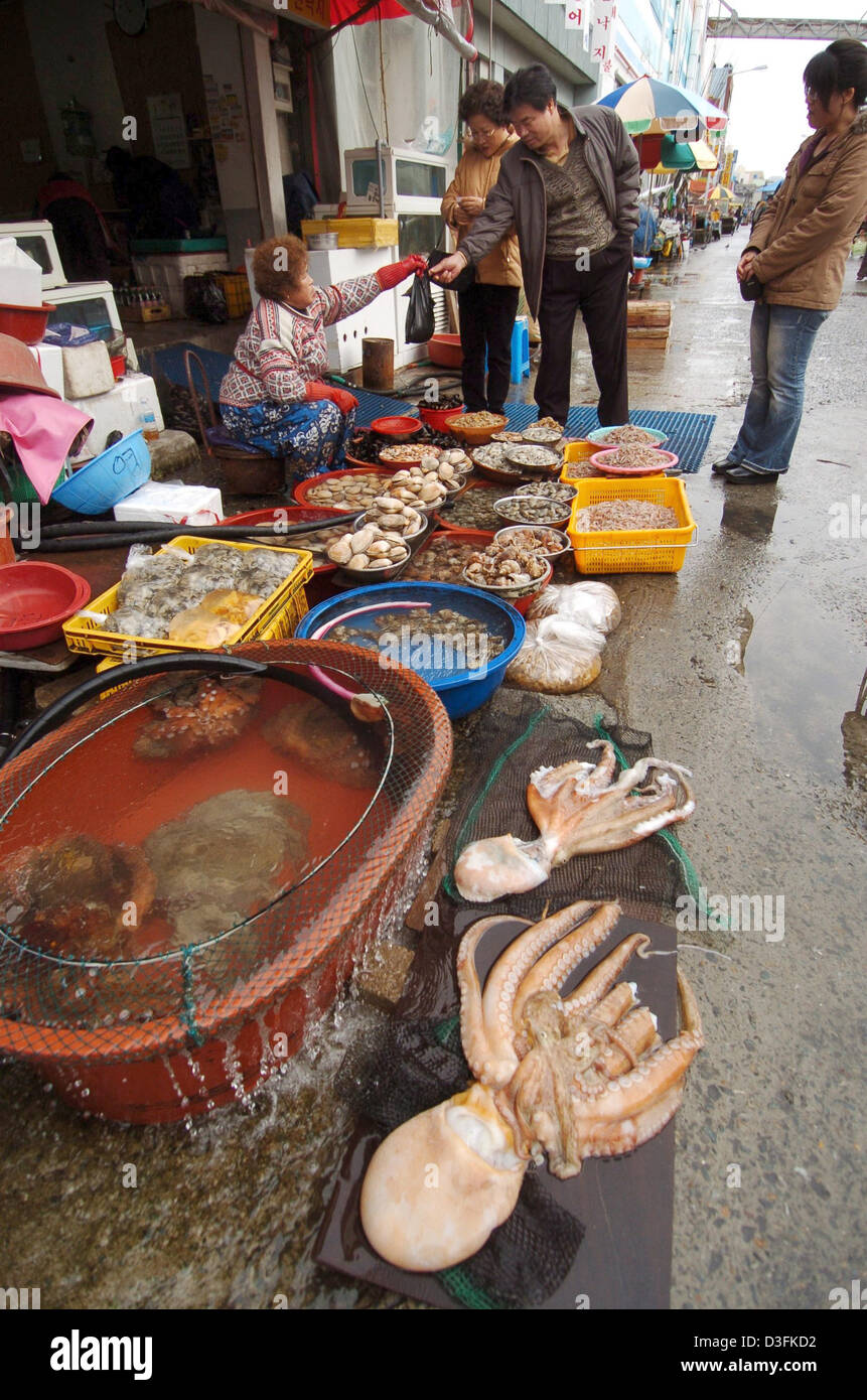 (dpa) - Squid and other seafood are for sale at the fish market in ...