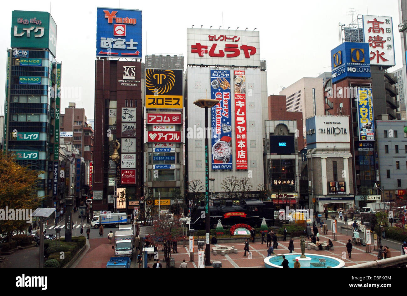 (dpa) - A view of buildings with billboards and advertisements in Tokyo ...