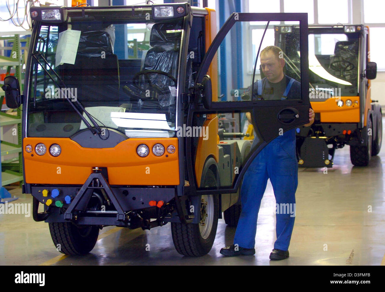 (dpa) - An employee stands next to the new narrow-gauge equipment ...
