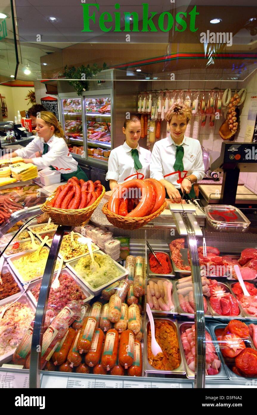 (dpa) - Employees proudly present the large variety of meat products on ...