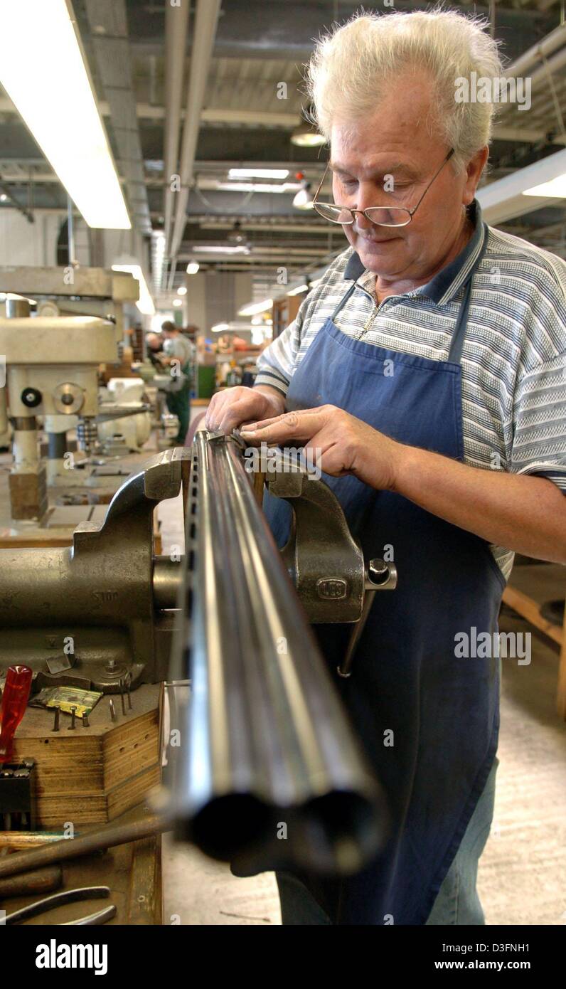 (dpa) - Gunsmith Juergen Berthold works on a double-barrel hunting ...