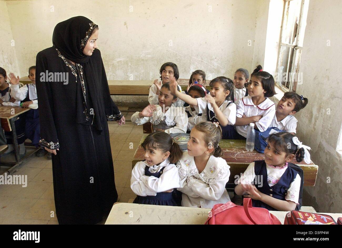 (dpa) - A teacher stands in a classroom of a girls school in Nasiriya ...
