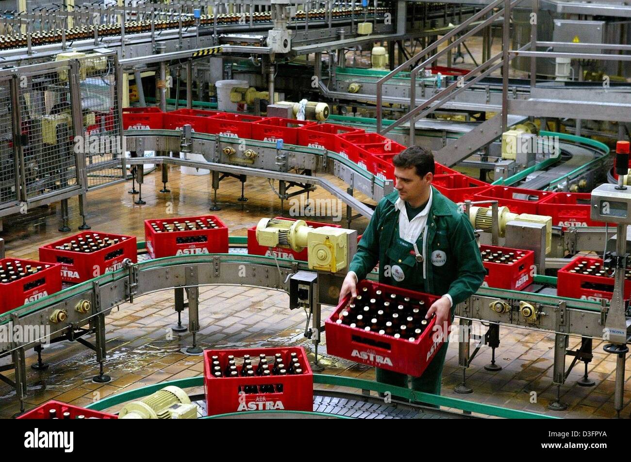 (dpa) - An employee sorts beer crates of Astra beer, a brand of the ...