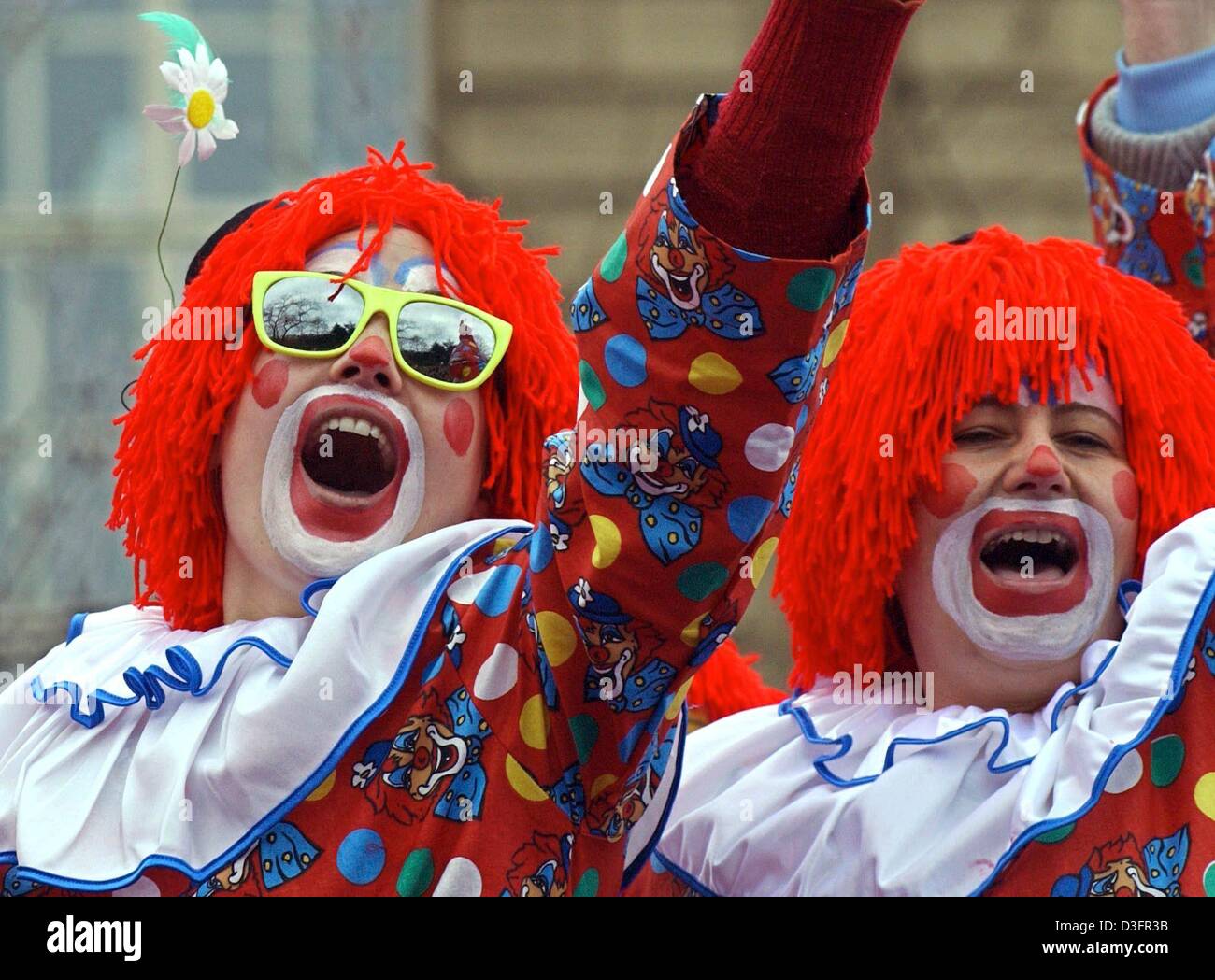 (dpa) - Carnival fools dressed as clowns celebrate during the ...