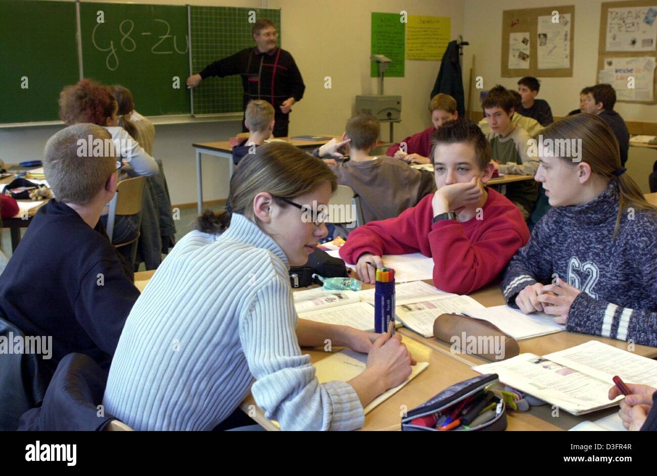 (dpa) - Teacher Wolfgang Scholl (back R) teaches pupils of the 7th year ...