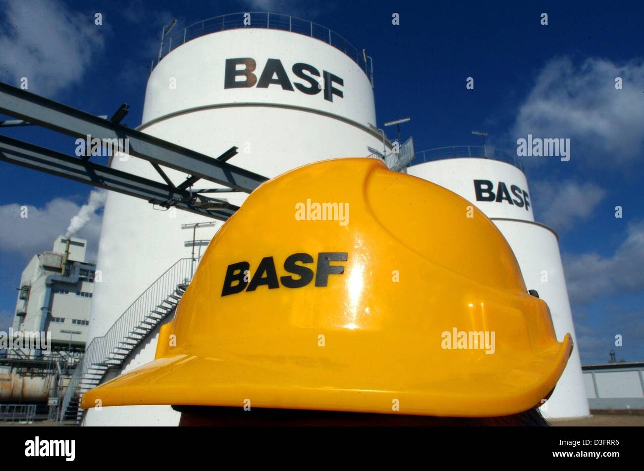 (dpa) - An employee of BASF, the world's leading chemical company, stands with his yellow helmet ...