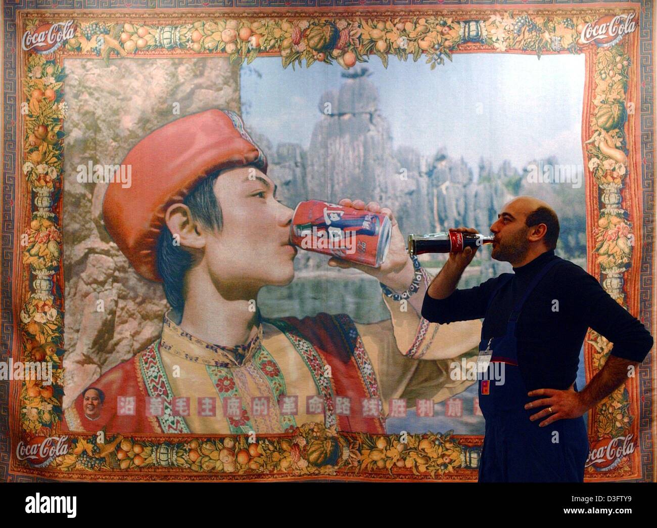 (dpa) - A worker drinks a coke in front of a tapestry by artist Margret ...