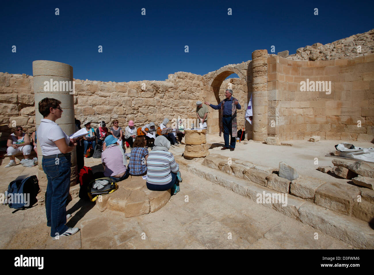A group of Christian tourists praying at the Northern Byzantine Church ...