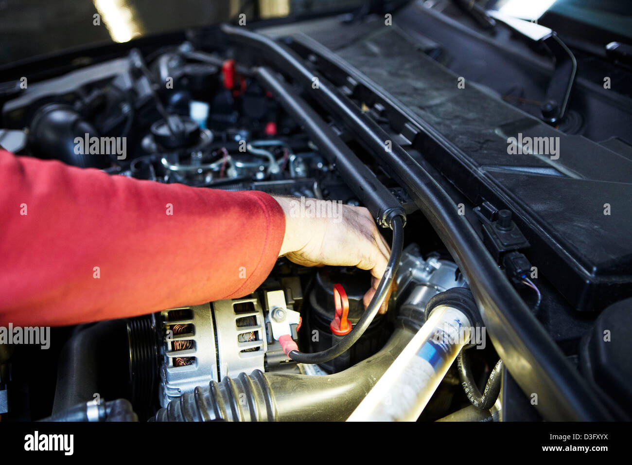 Car mechanic at work in his auto repair shop Stock Photo - Alamy