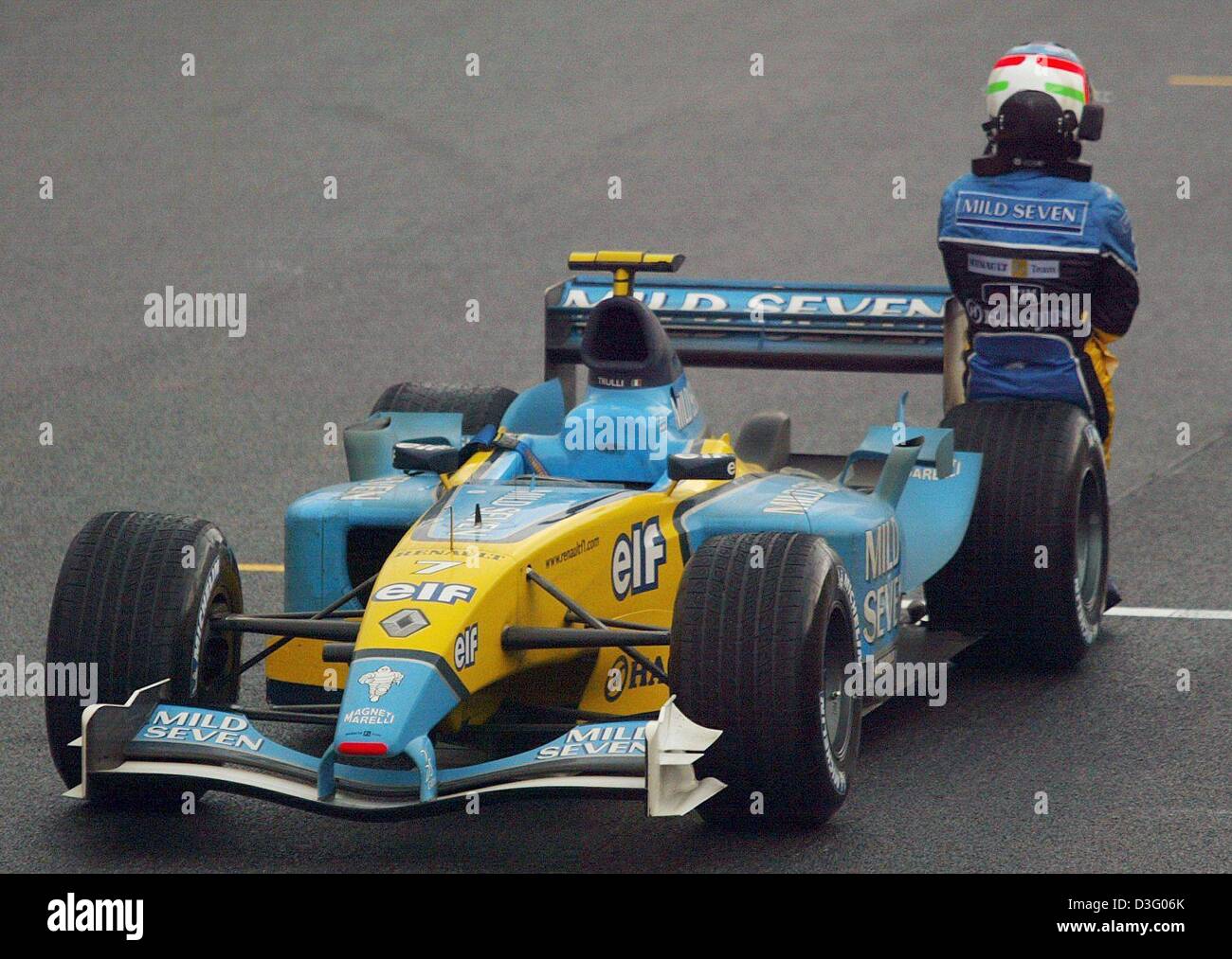 (dpa) - Italian formula one pilot Jarno Trulli sits on the rear tyre of ...