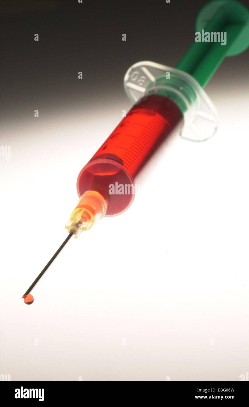 (dpa) - The symbolic picture shows an injection filled with a red ...