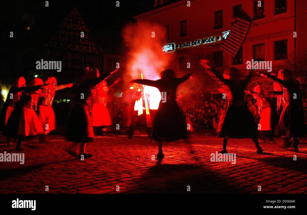 (dpa) - Witches dance around a cauldron to celebrate the Witches ...