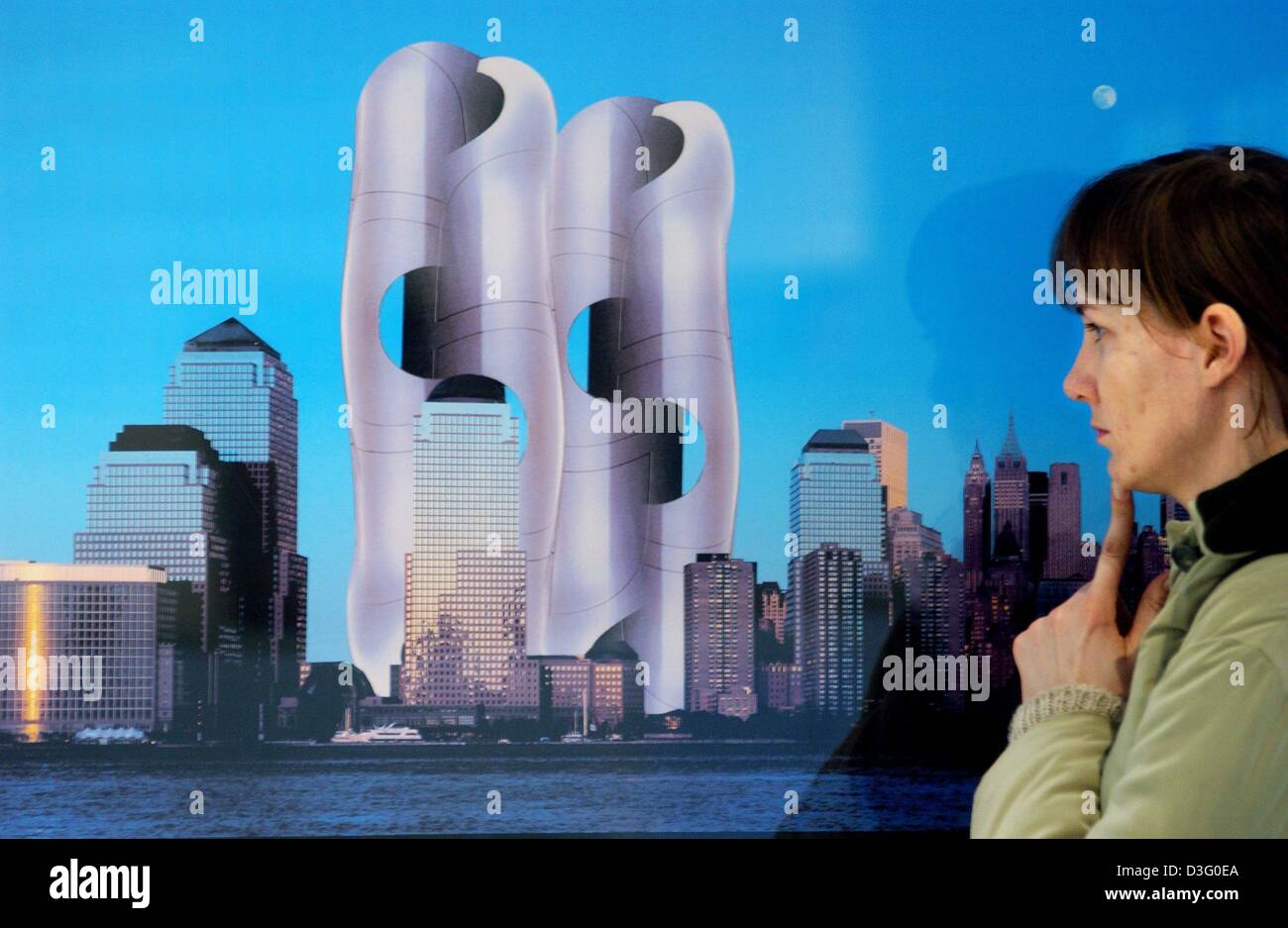 (dpa) - A woman is looking closely at a design proposal by Hani Rashid ...