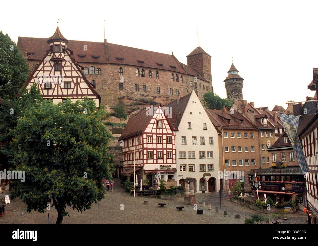 (dpa files) - A view of the Kaiserburg (Nurnberg castle) towers above ...