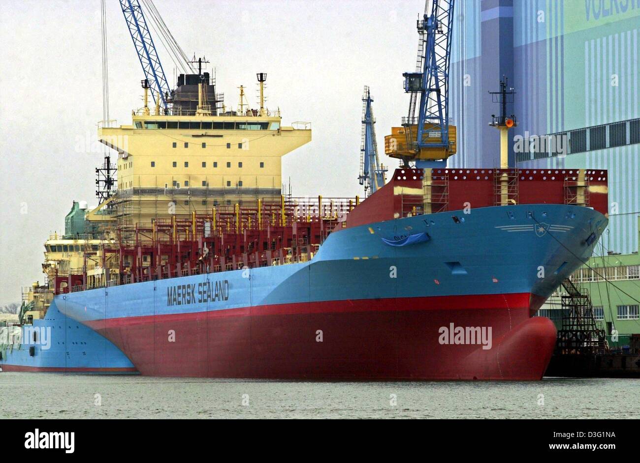 (dpa) - A newly built container ship docks at the pier of the ...