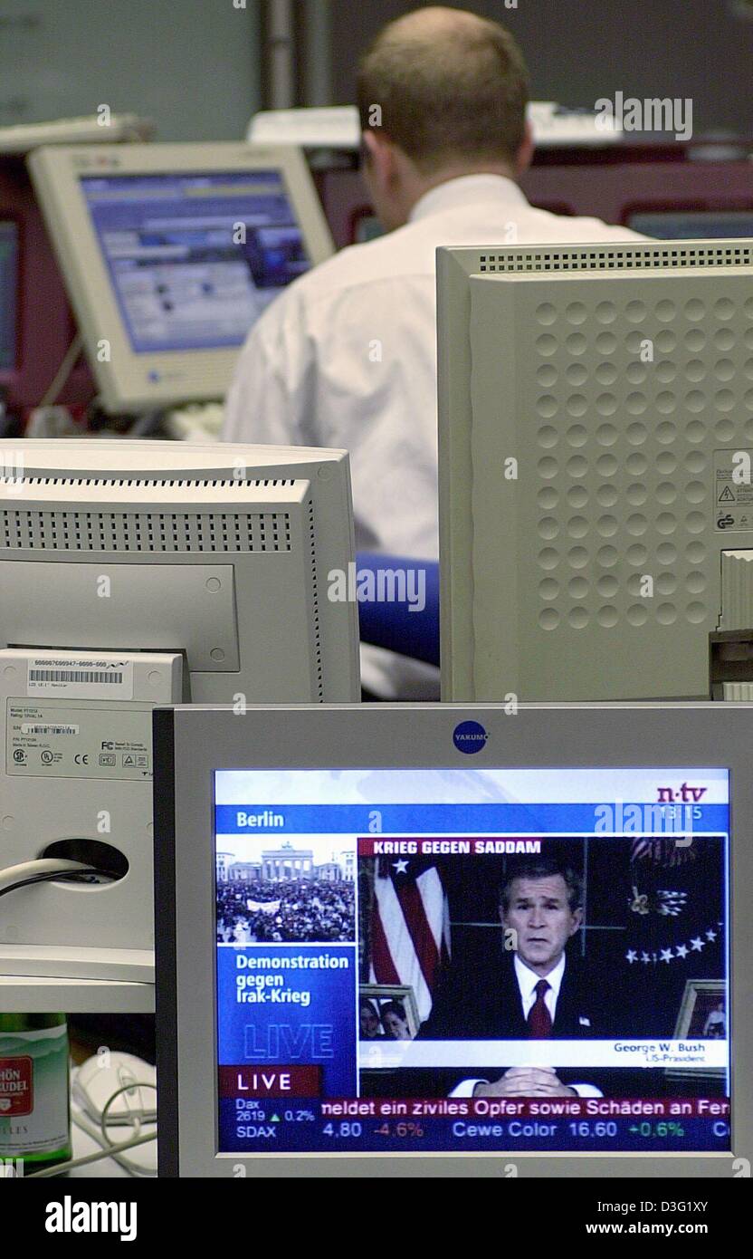 (dpa) - A stock broker sits in front of his computer terminal while ...