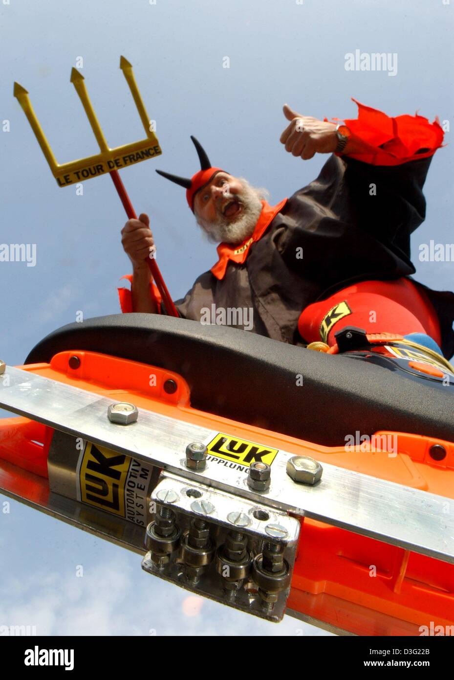 (dpa) - Bicycle designer Dieter 'Didi' Senft, dressed in a devil's ...