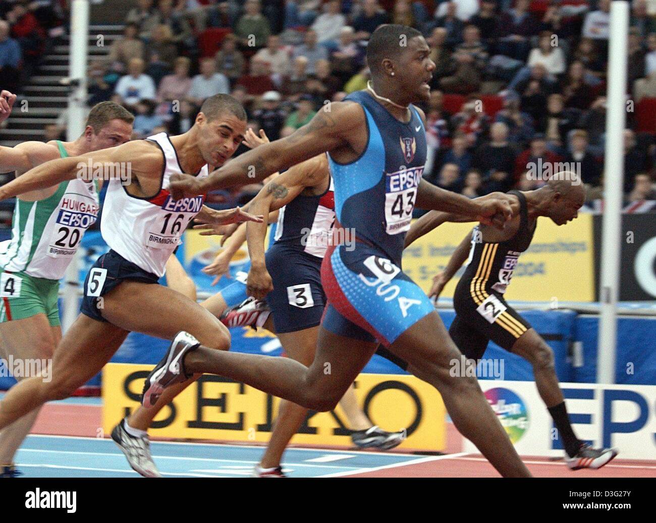 (dpa) - US sprinter Justin Gatlin (front R) celebrates as he crosses ...