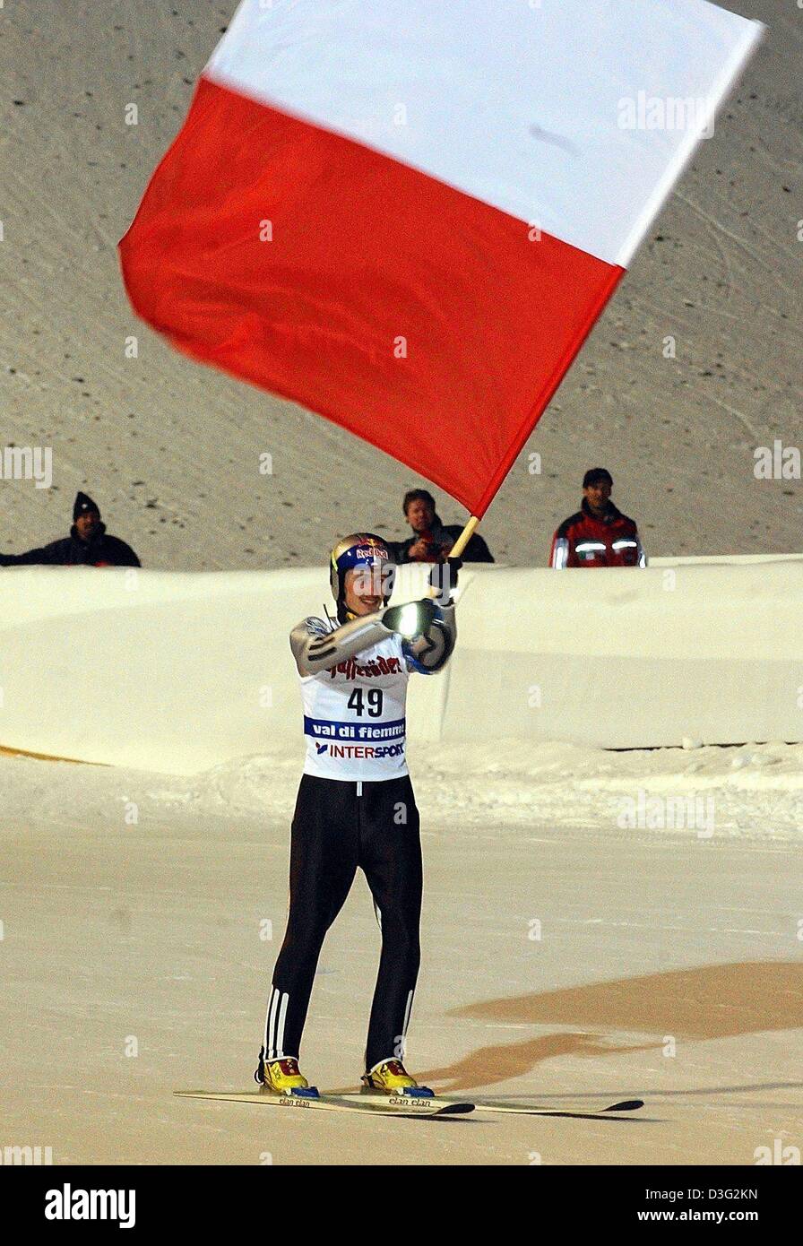 (dpa) - Poland's Adam Malysz waves the Polish national flag as he ...