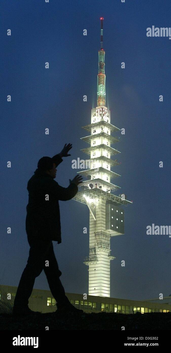 (dpa) - A man seems to reach out to touch the illuminated Telemax radio ...