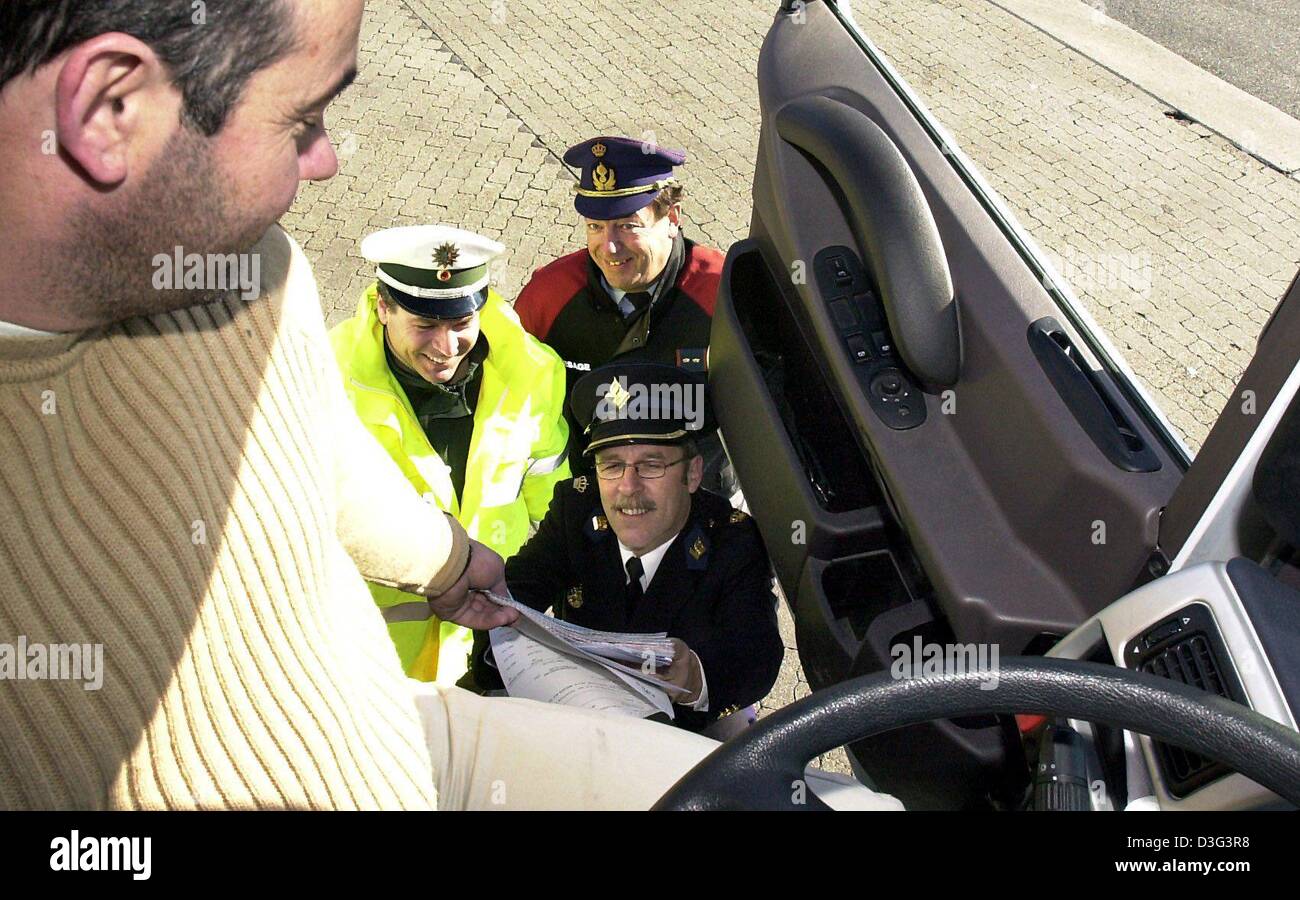 (dpa) - A Dutch, German and Belgian police officer conduct a routine ...