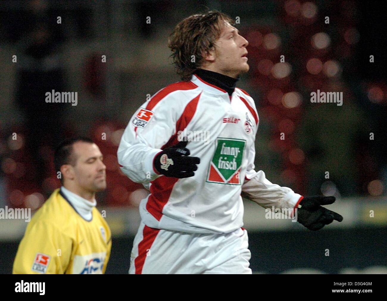 (dpa) - Cologne's Ukrainian forward Andrej Voronin (front) cheers after ...