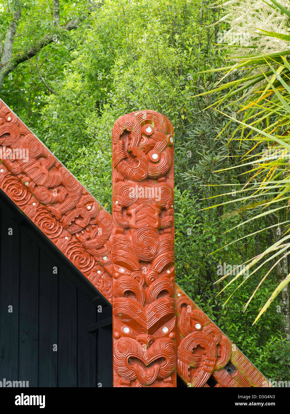View and detail of the wharepuni (Maori meeting house) in the rear of ...