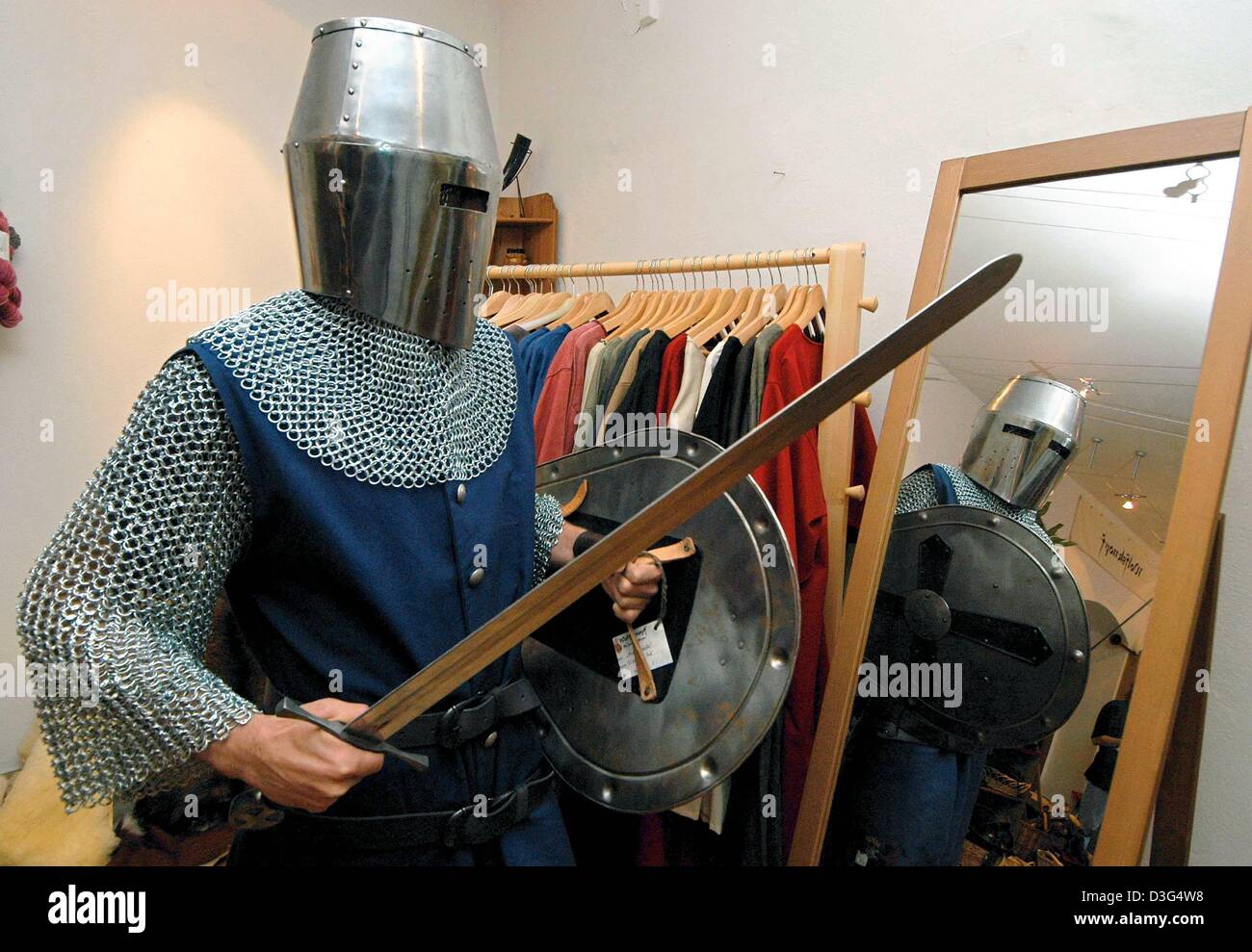 (dpa) - Sebastian Brenner wears a mediaeval knight's armour, a sword ...
