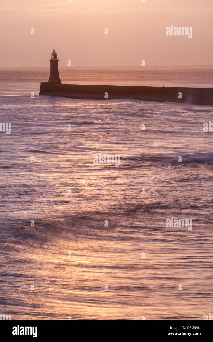 Tynemouth Pier backlit by a winter's sunrise, Tyne & Wear, England ...