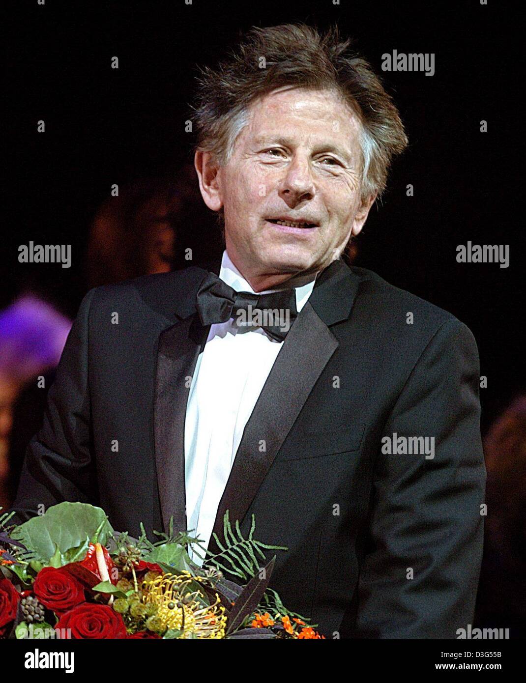 (dpa) - Director Roman Polanski steps forward to acknowledge the ...