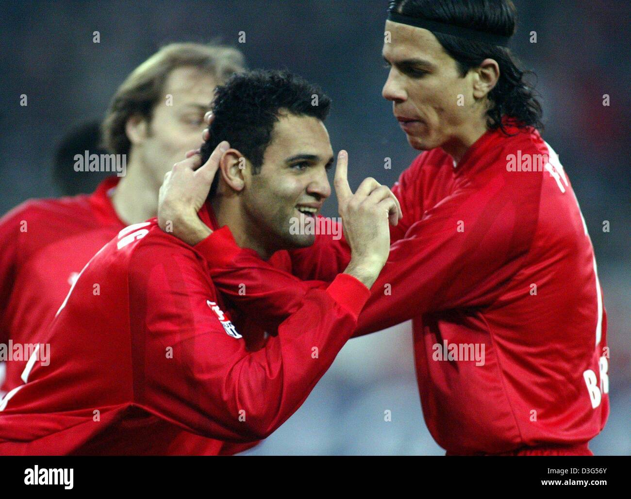 (dpa) - Freiburg's Swiss player Bruno Berner (R) congratulates his ...