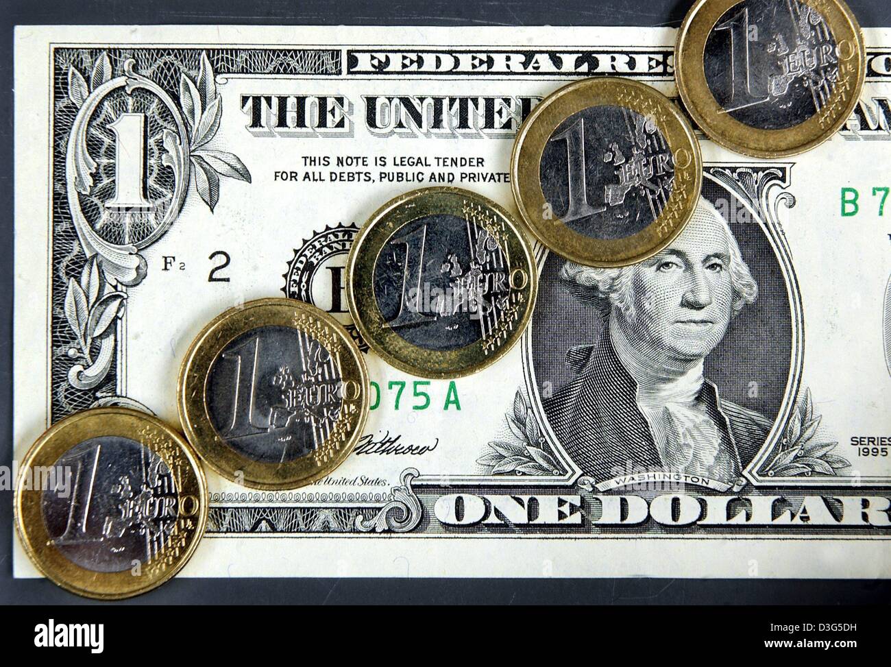 (dpa) - The symbolic photo shows an ascending line of one euro coins on ...