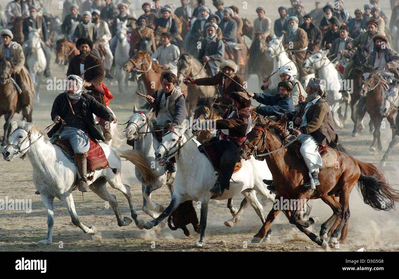 (dpa) - Afghan horsemen chase the player who grabbed the goat during ...