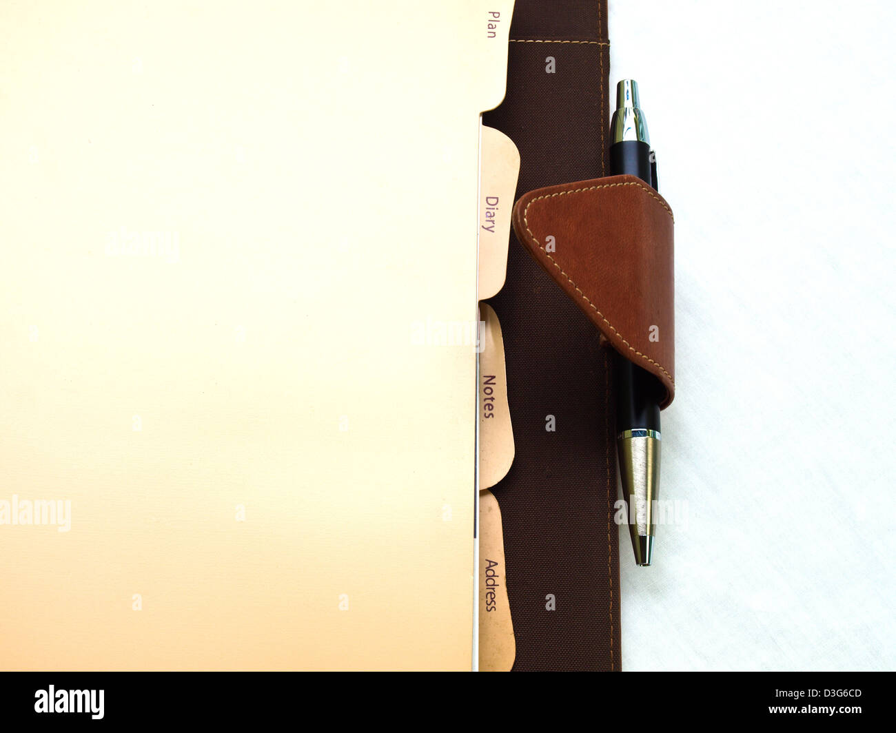 Cover page of organizer with a pen Stock Photo - Alamy