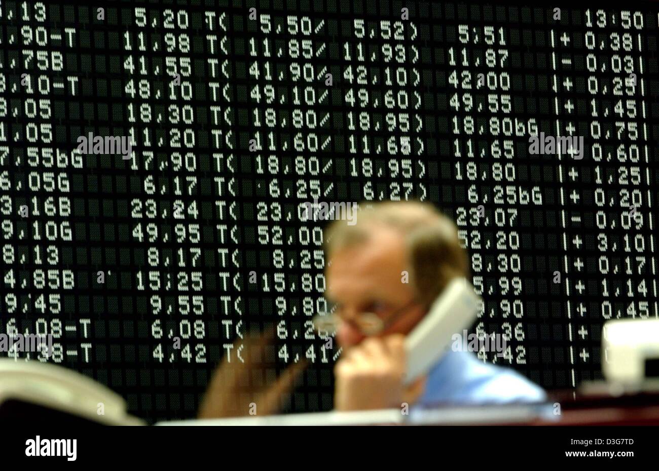 (dpa) - A stock market dealer makes a telephone call on the trading ...