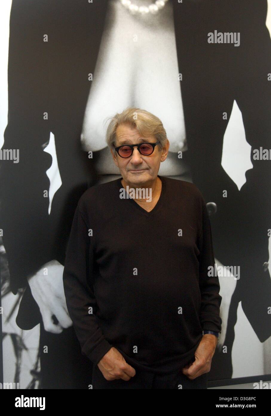 (dpa files) - Star photographer Helmut Newton poses in front of a ...