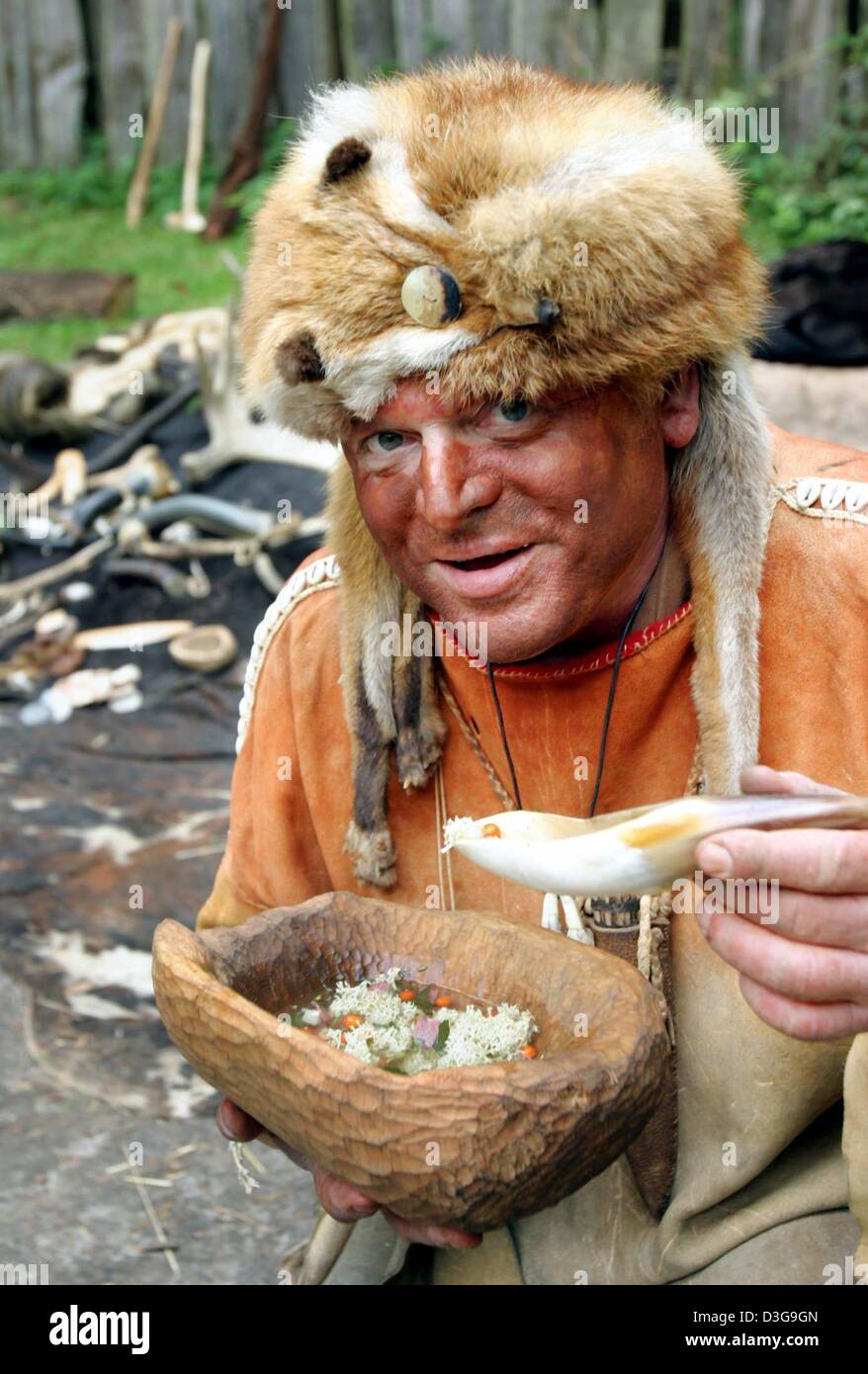 (dpa) - Adventure educator Hartmut Albrecht, dressed like a hunter from ...