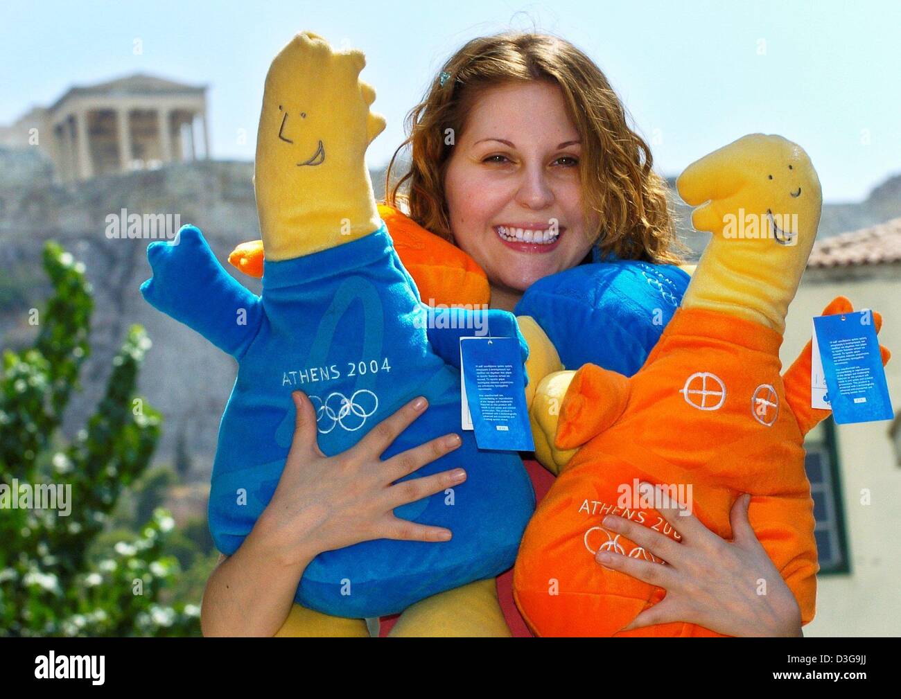 (dpa) - The young Greek woman Eve holds in her arms the two mascots for ...
