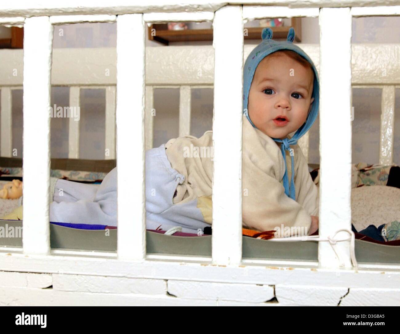 (dpa) - The photo shows an infant in an orphanage in Chisinau, Moldova ...