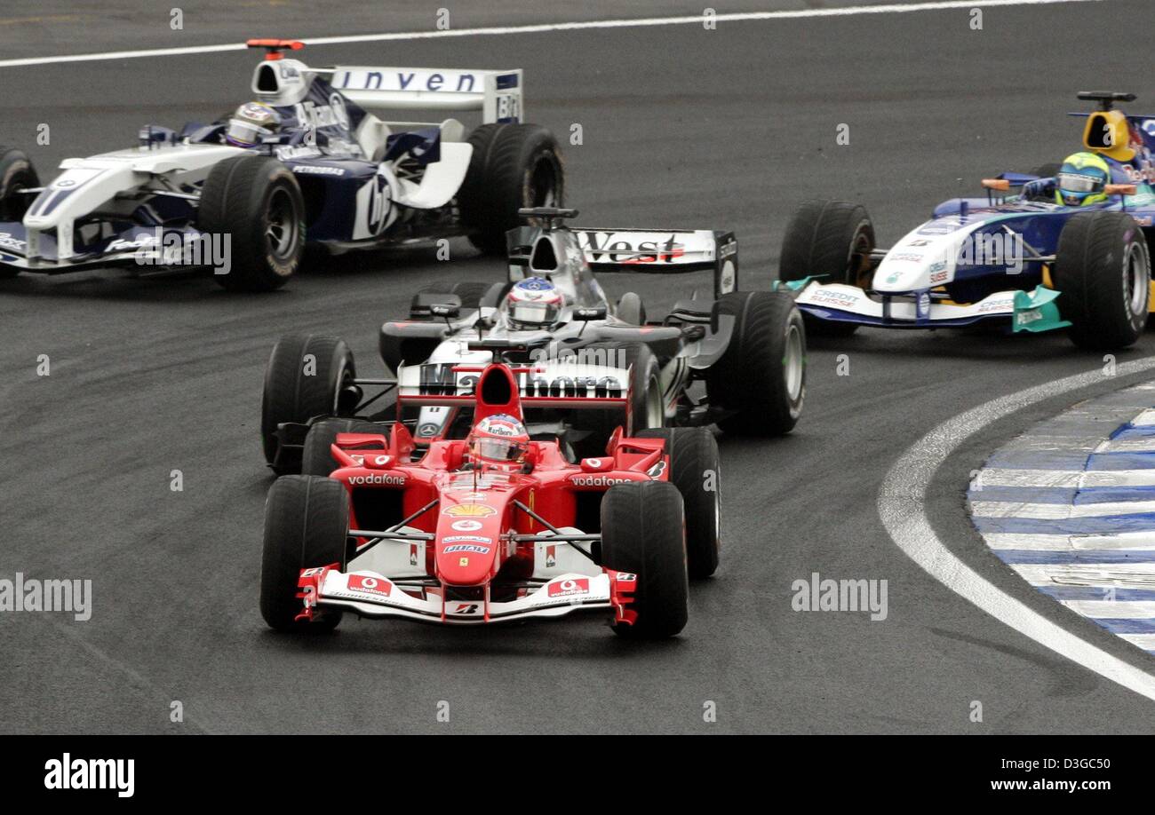 (dpa) - Brazilian formula one driver Rubens Barrichello (front) of ...