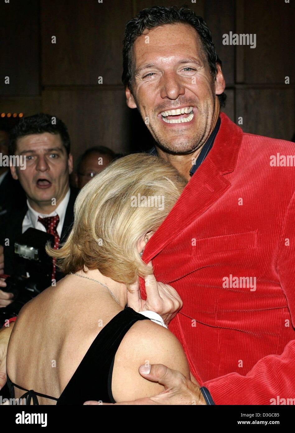 (dpa) - Charity organiser Ute-Henriette Ohoven hides her face under the ...