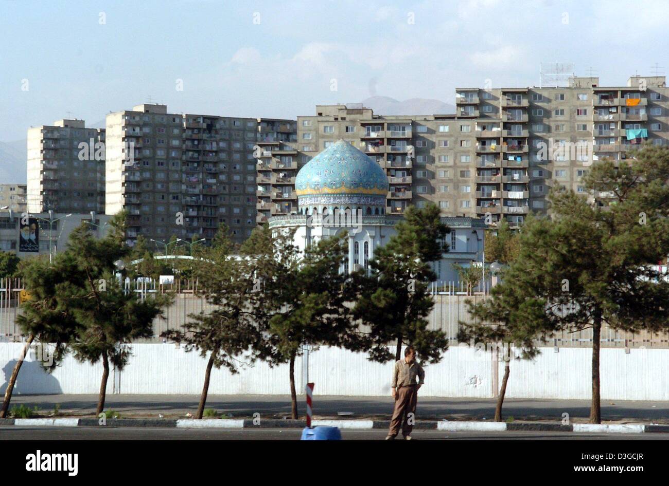 (dpa) - A modern housing development can be seen behind a traditional ...