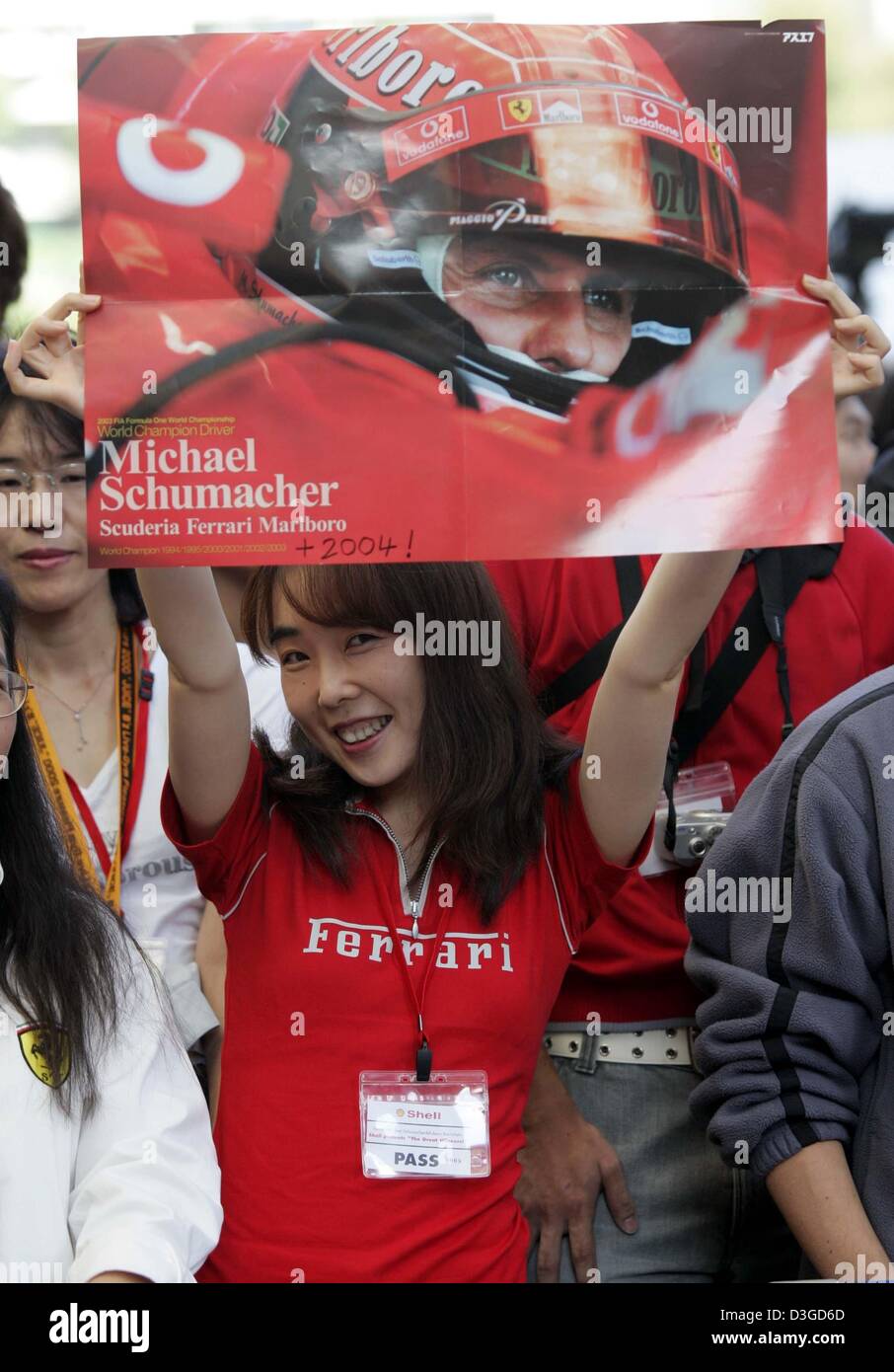 (dpa) - A female Ferrari fan holds up a sign during an appearance by ...