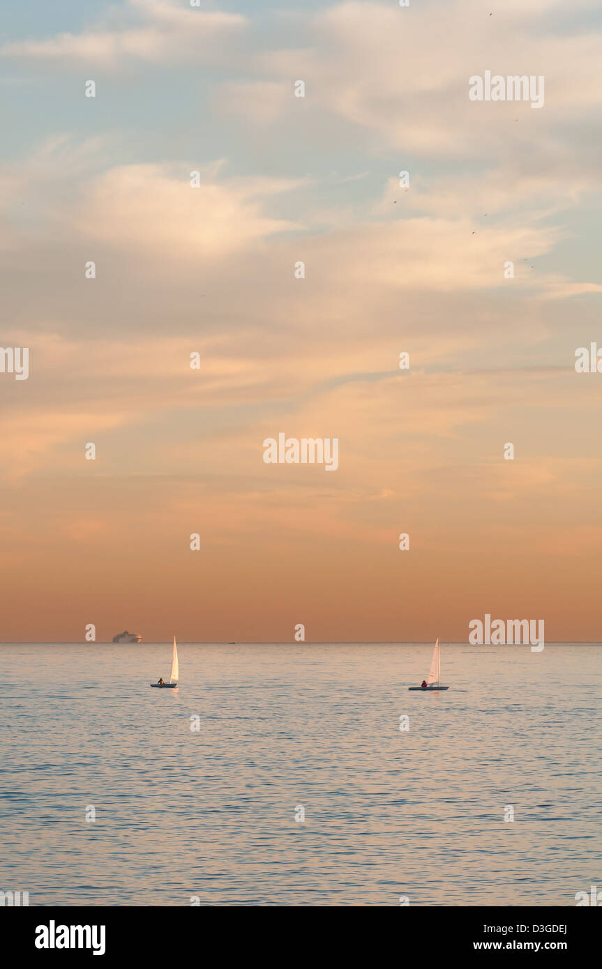 Sailboats and a cruise ship at distance Stock Photo - Alamy