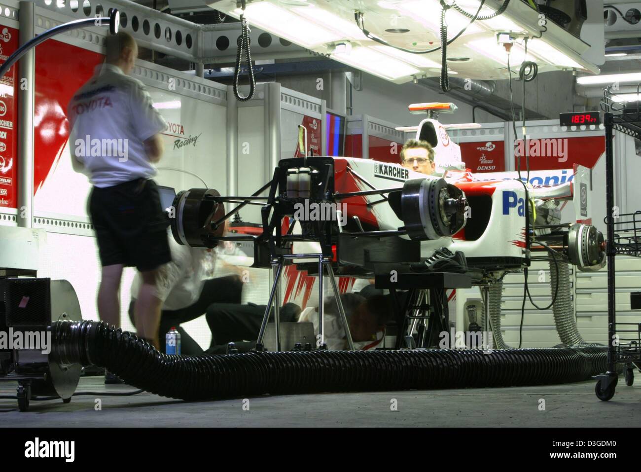 (dpa) - Mechanics work on a racing car at the Toyota pit on the new ...