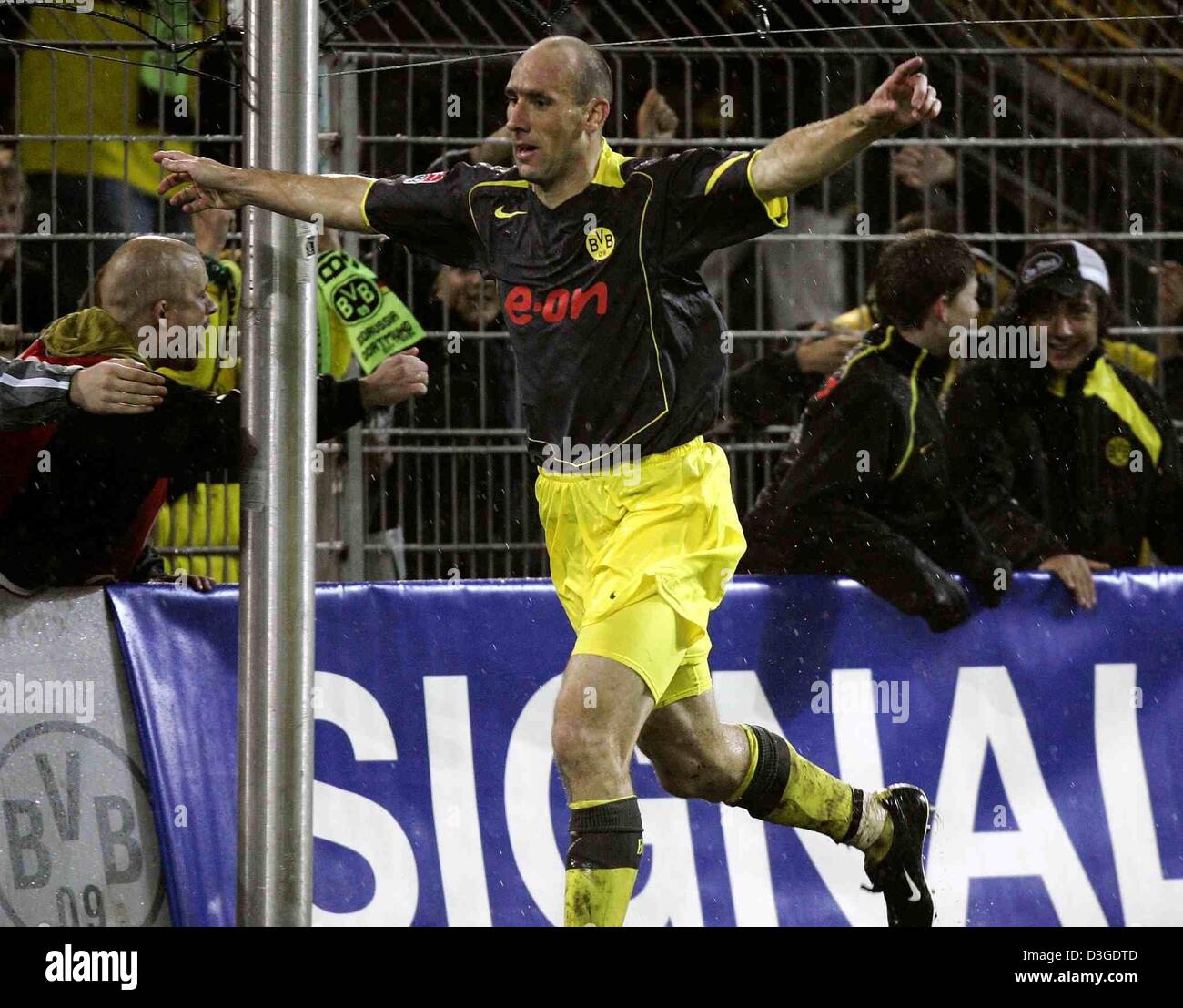 (dpa) - Dortmund's Jan Koller cheers after scoring the 2-0 lead during ...