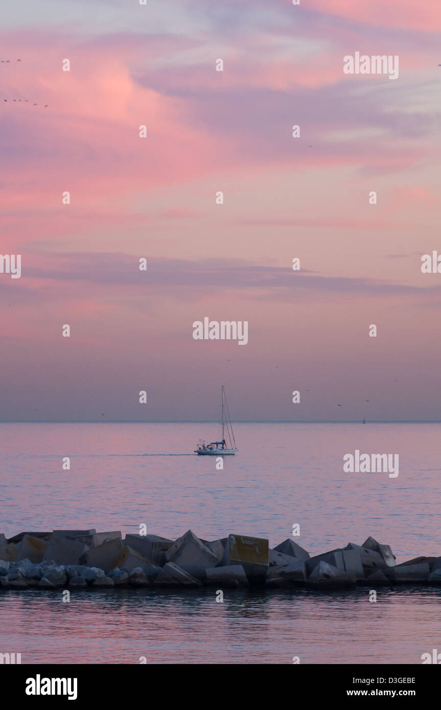 Sailboat at sunset Stock Photo - Alamy