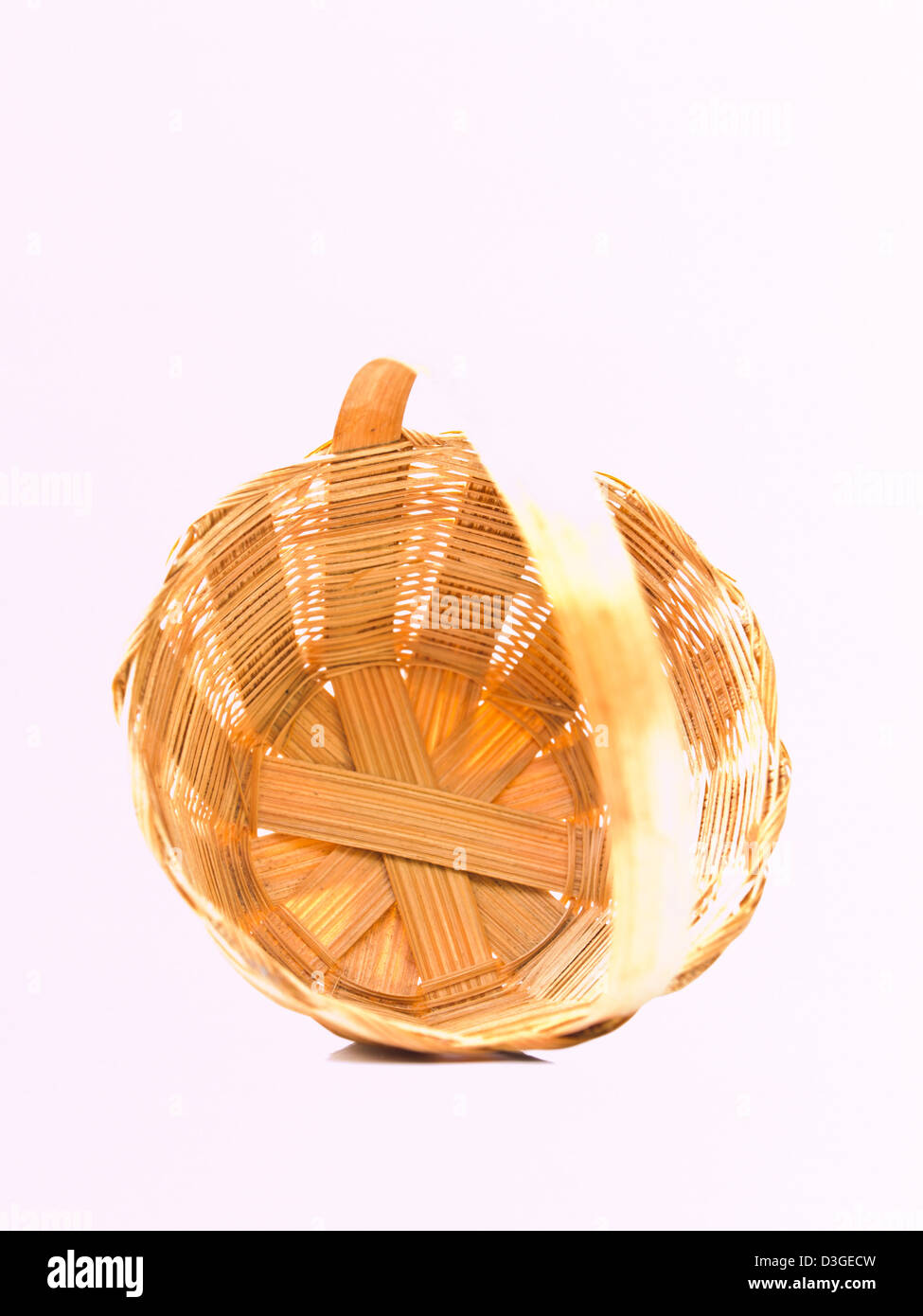 A yellow wicker basket isolated on white background Stock Photo - Alamy